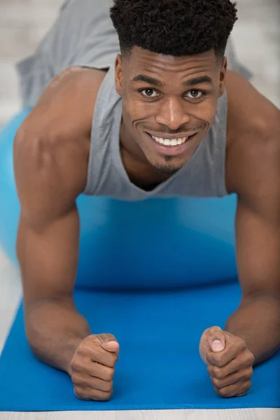 man in plank position exercising at home - Stock Image - Everypixel