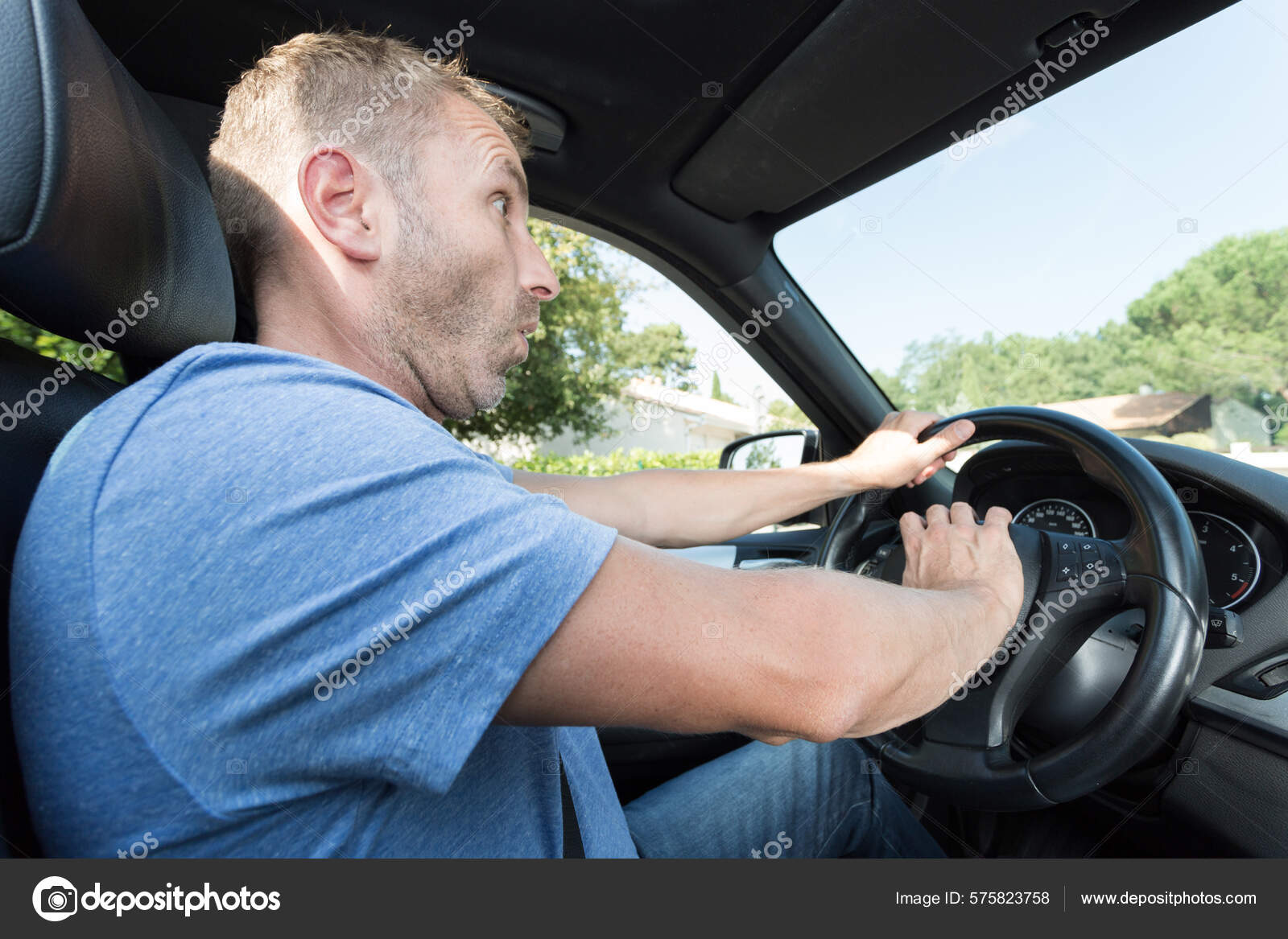 Surprised Male Driver Honking Car Horn — Stock Photo © photography33 #575823758