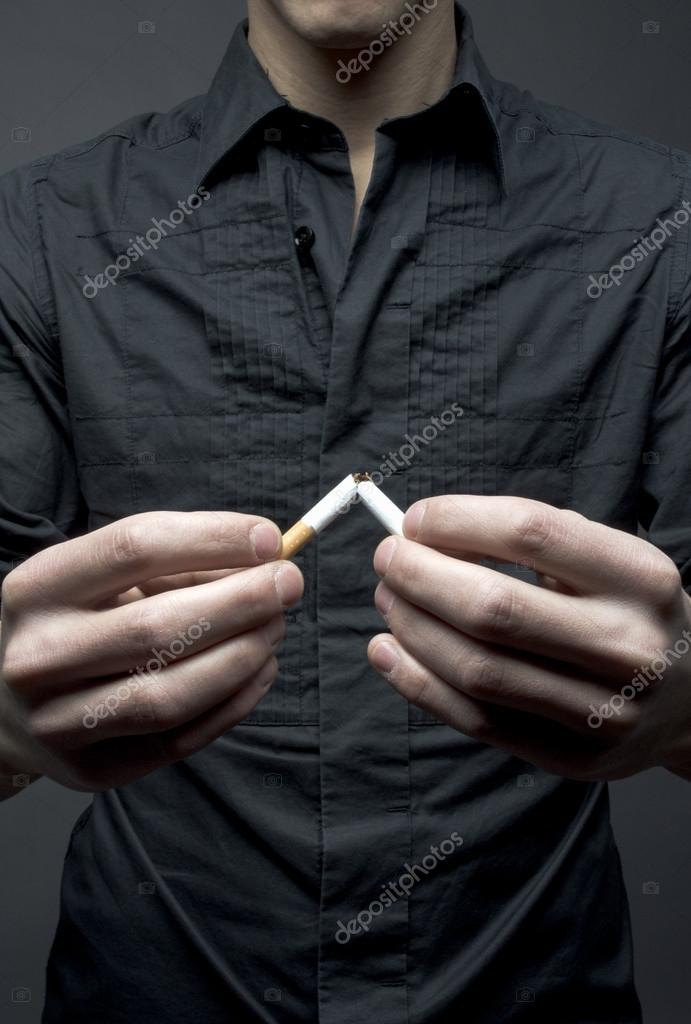 Man breaks cigarette — Stock Photo © 12_Tribes #19478807
