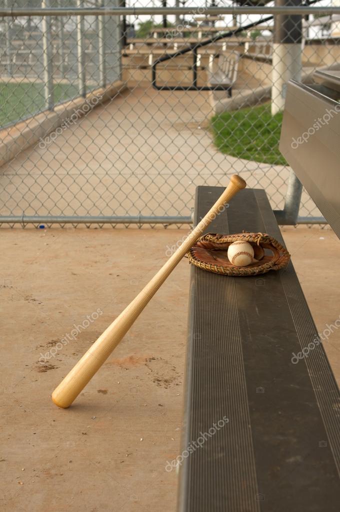 Baseball Bat and Glove in the Dugout — Stock Photo © 33ft #12761688