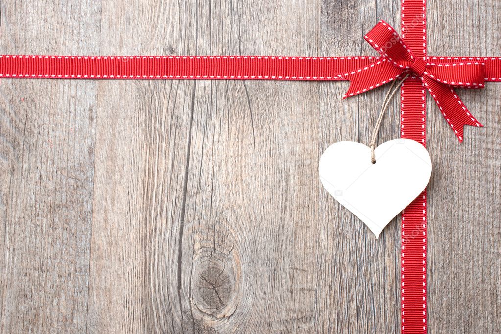 Red ribbon and bow with heart Stock Photo by ©alexraths 19492497