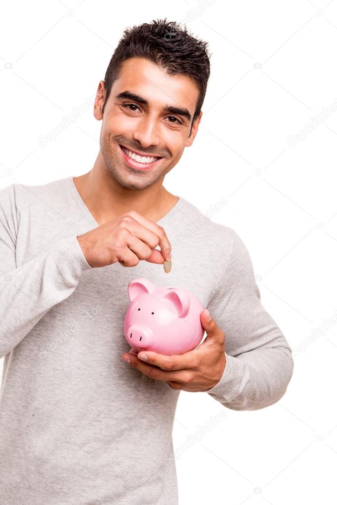 Man saving money to a piggy bank — Stock Photo © jolopes #31545593