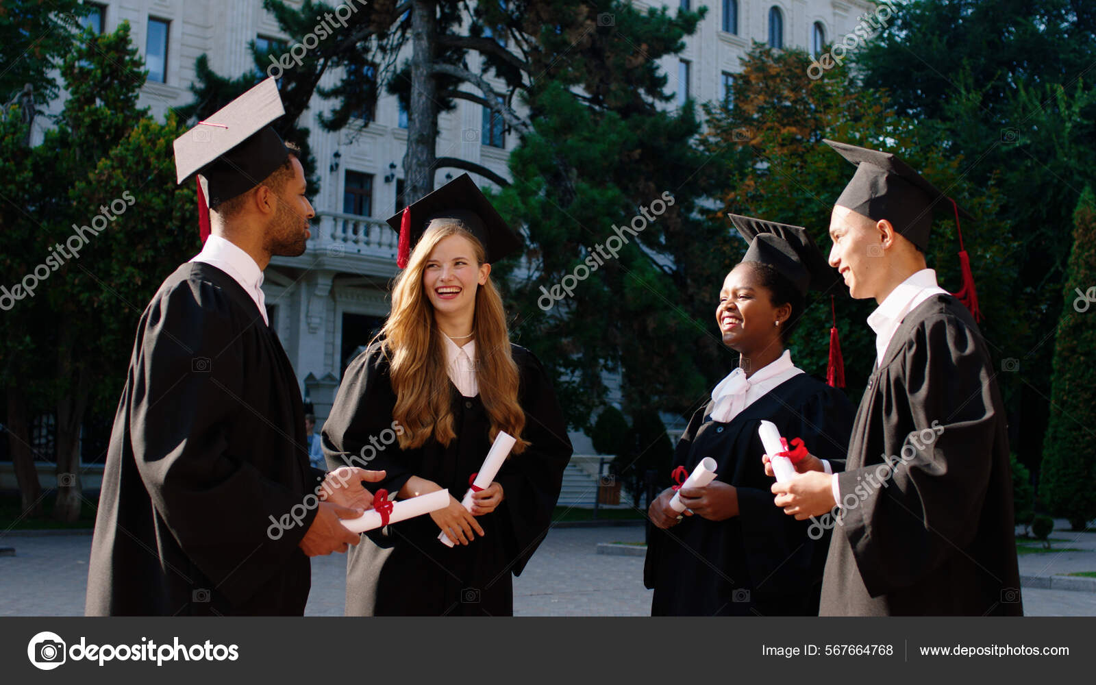 Graduation day in the college garden group of students graduates ...