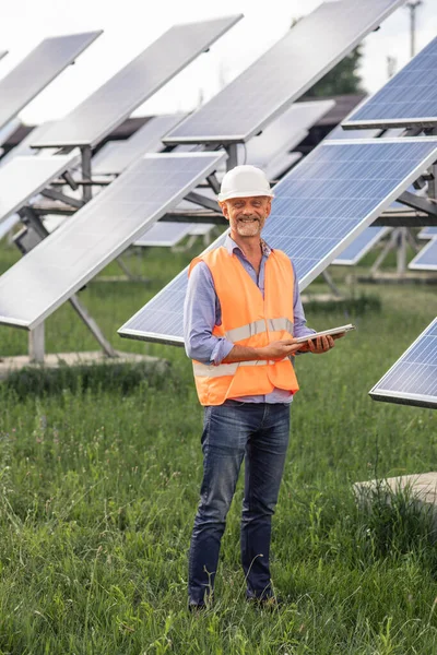 In front of the camera ecological engineer man with safety equipment ...