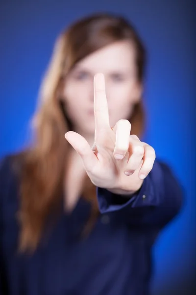 Woman's hand with one finger, warning symbol Stock Photo by ...