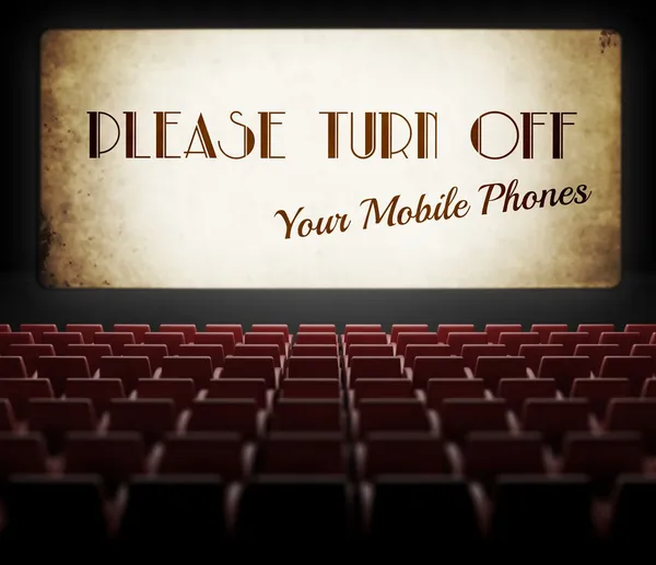 Please turn off cell phones movie screen in old cinema - Stock Image ...