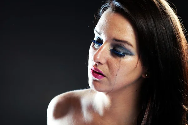 Hurt woman crying, smeared makeup Stock Photo by ©leszekglasner 46118941