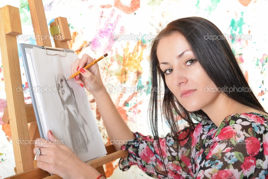 Beautiful woman painting with a paintbrush — Stock Photo © muro #14427543