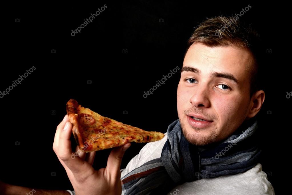 Young Man Eating Pizza Stock Photo by ©muro 20070973