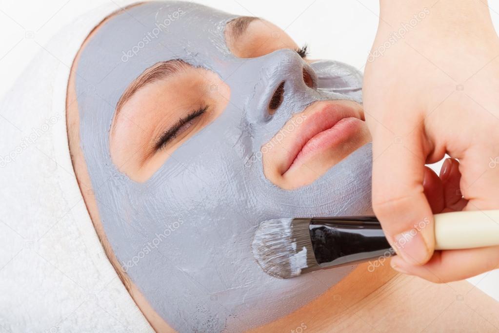 Applying facial mask Stock Photo by ©artem_furman 21591675