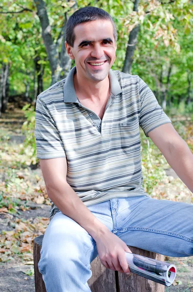 Laughing man with magazine - Stock Image - Everypixel