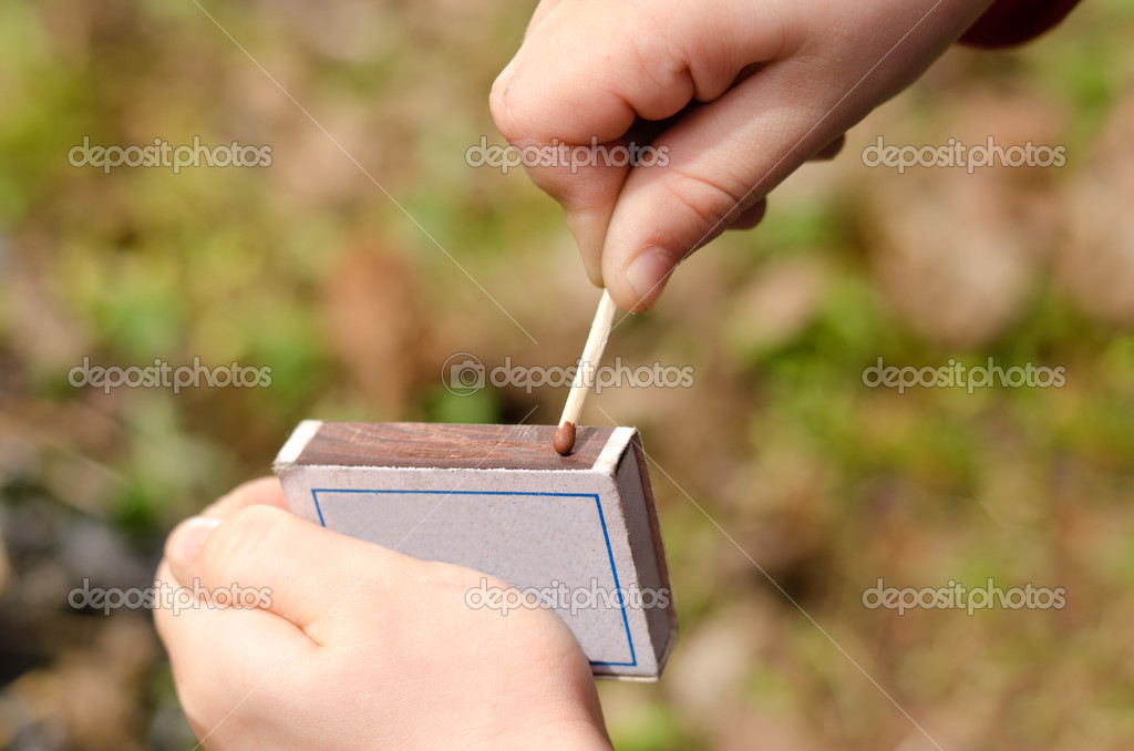 Child striking a match — Stock Photo © ampack #47579521