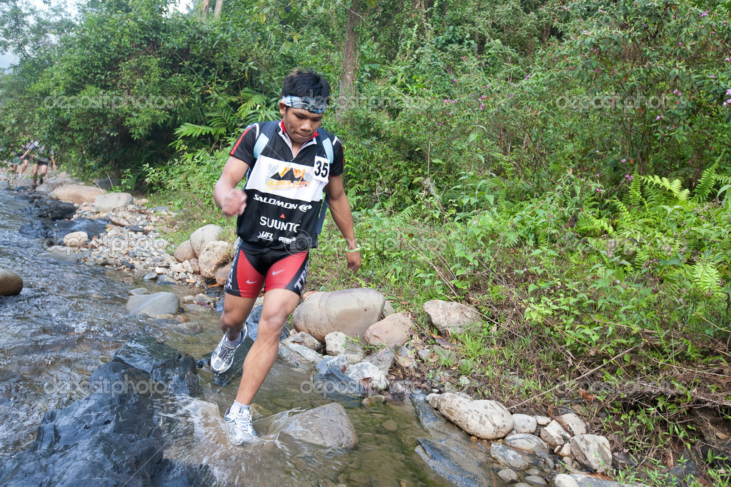 SABAH, MALAYSIA - APRIL 2ND. A racer from a participating team makes ...