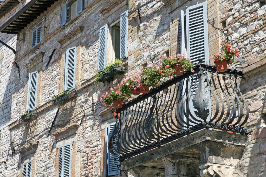 Flowered balcony in a terrace of an ancient medieval palace Stock Photo ...