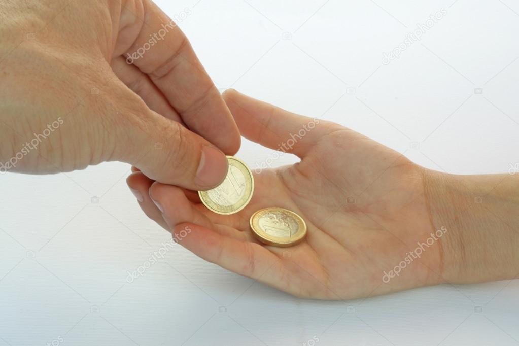 Generous hand of a father who gives a tip to his young son Stock Photo ...