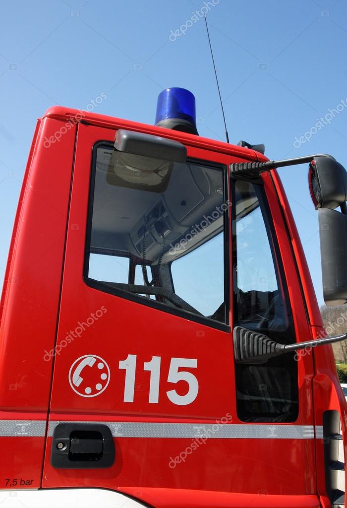 Cockpit of the fire truck during an emergency exit to rescue cit ...