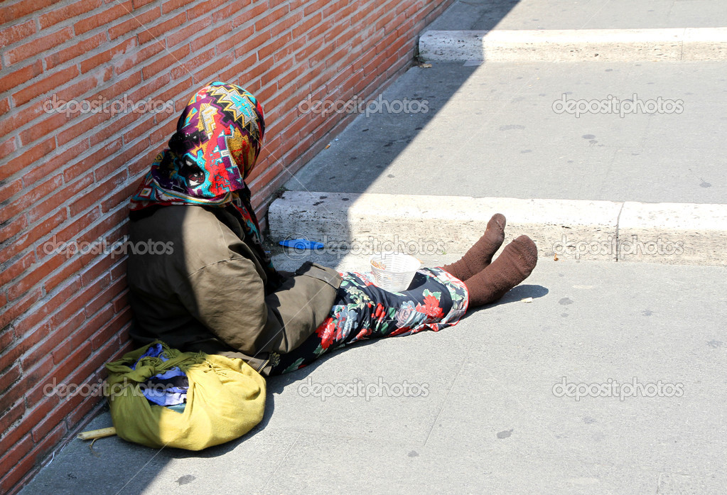 Gypsy with lurid clothes while begging on the street — Stock Photo ...