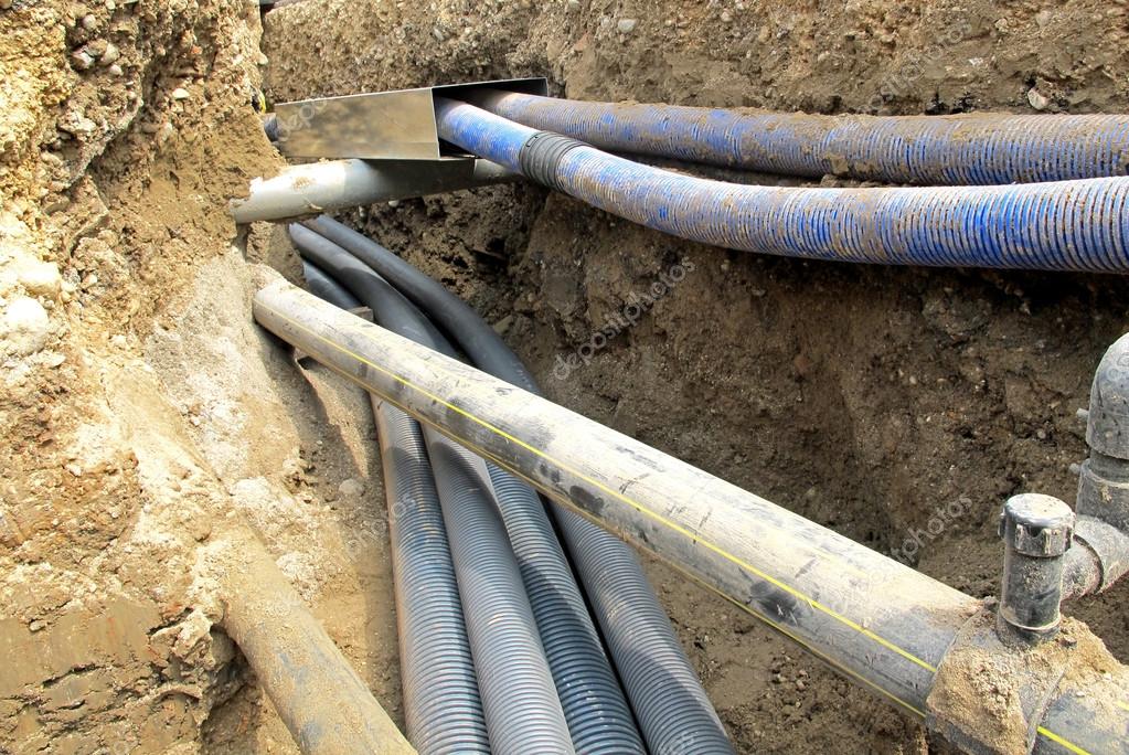 Electrical cables and optical fibres in the digging Stock Photo by ...