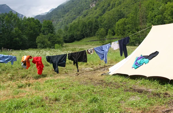 Drying laundry to dry near the camping tents - Stock Image - Everypixel