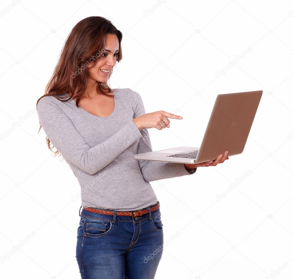 Charming woman pointing on laptop screen Stock Photo by ©pablocalvog ...