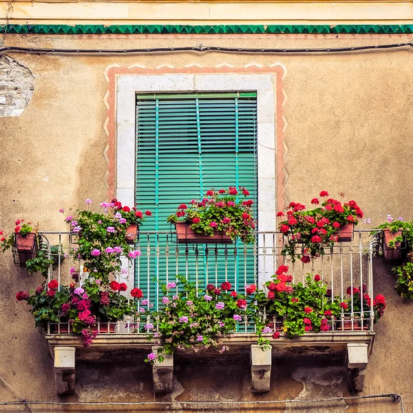 Beautiful vintage balcony with colorful flowers and doors Stock Photo ...