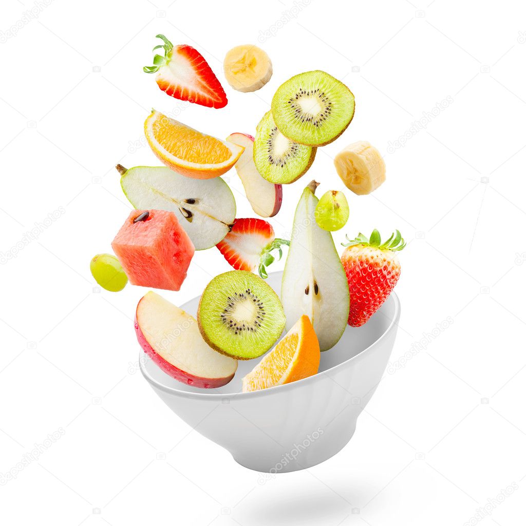 Light salad with flying fresh fruits Stock Photo by ©bonninturina 23731519