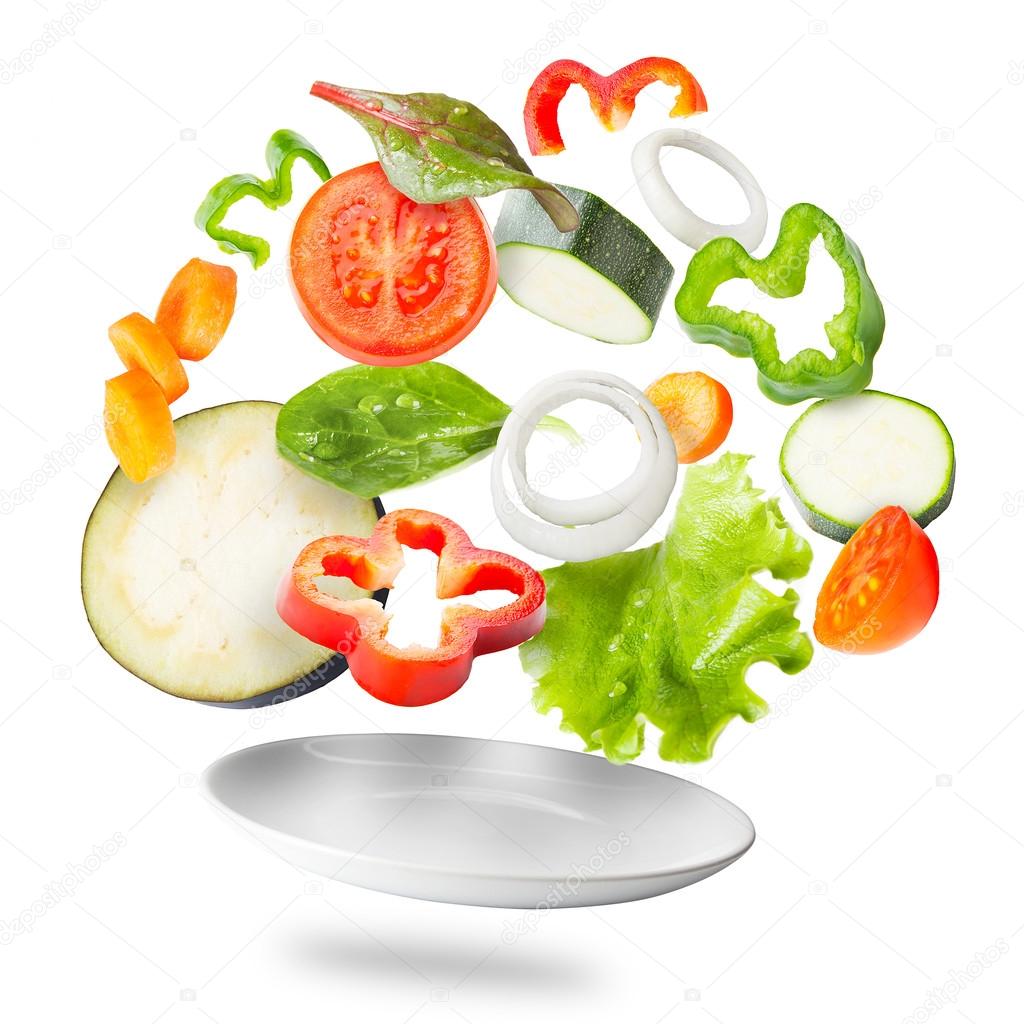 Assorted fresh vegetables flying in a plate Stock Photo by ...