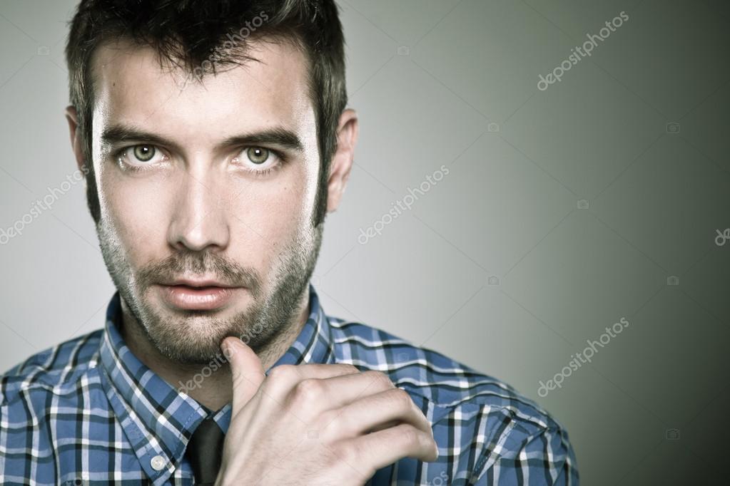 Portrait of a normal boy over grey background. Stock Photo by ...