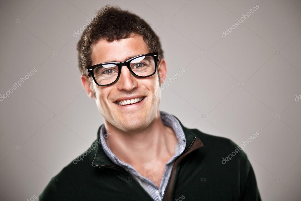 Portrait of a normal boy smiling over grey background. Stock Photo by ...