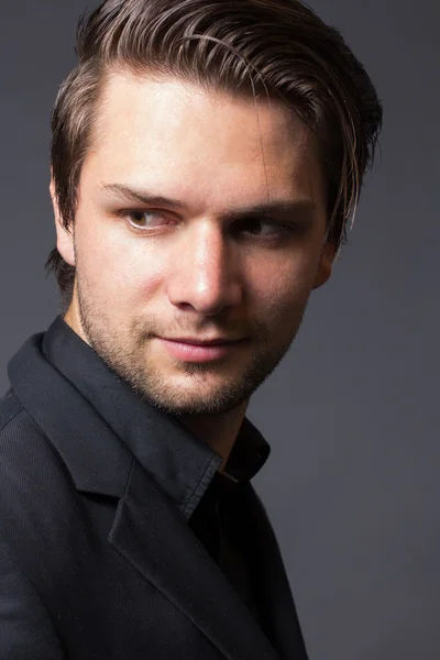 Face of a man in a Black Suit - Stock Image - Everypixel