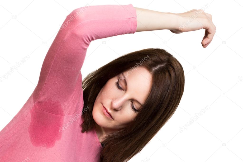 Woman sweating very badly under armpit — Stock Photo © Dandaman #31578075