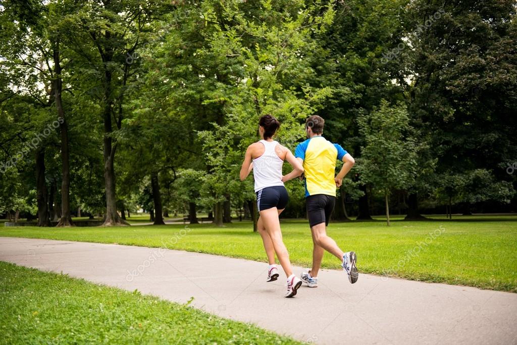 Jogging together - young couple running Stock Photo by ©martinan 22569041