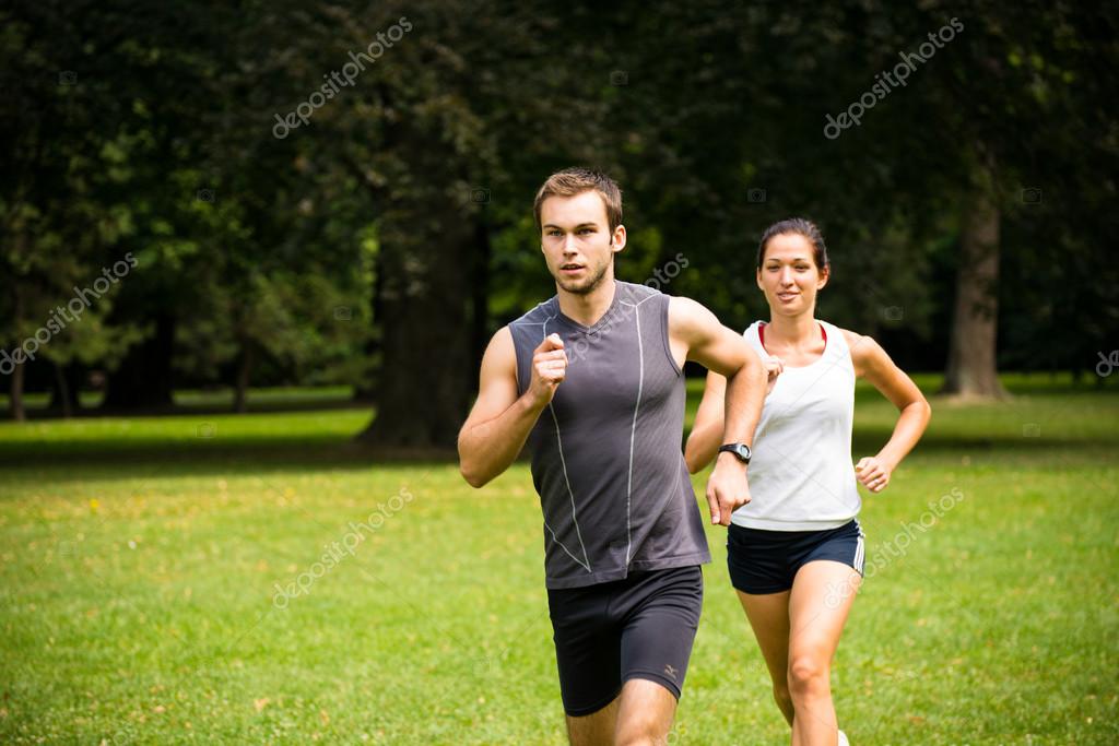 Running together - young couple jogging Stock Photo by ©martinan 23491761