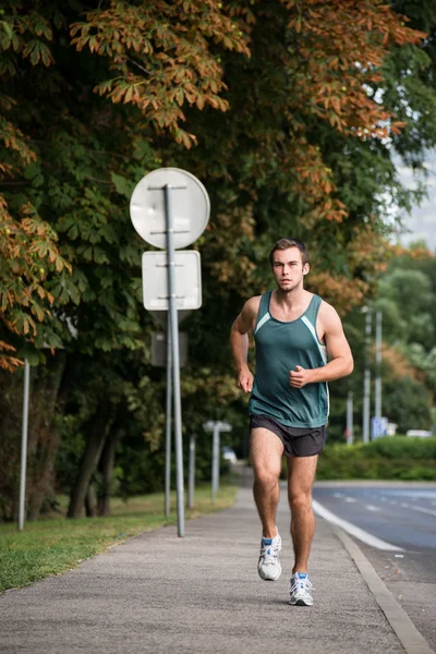 Training - man running in street - Stock Image - Everypixel