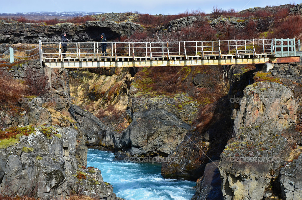 Hraunfossar lava waterfalls falling with blue water on the Iceland ...