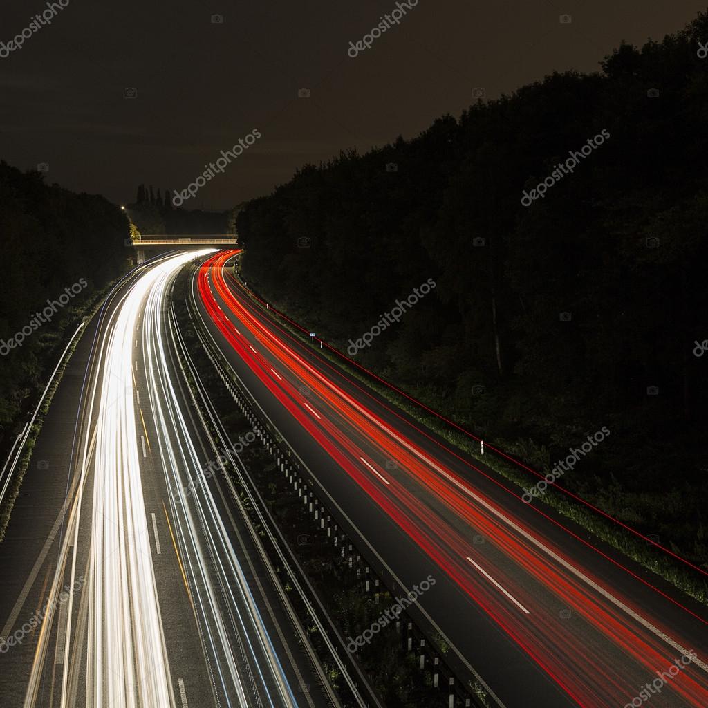 Long time exposure freeway cruising car light trails streaks of light ...