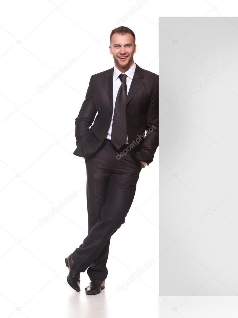 Businessman standing near Billboard — Stock Photo © doodko #23918201 Businessman standing near Billboard — Stock Photo © doodko #23918201