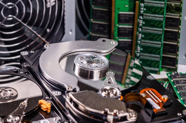 an open computer hard drive between other parts of the computer ...