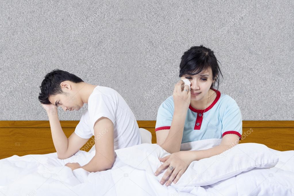 Crying girlfriend after fight in bed Stock Photo by ©realinemedia 24126825