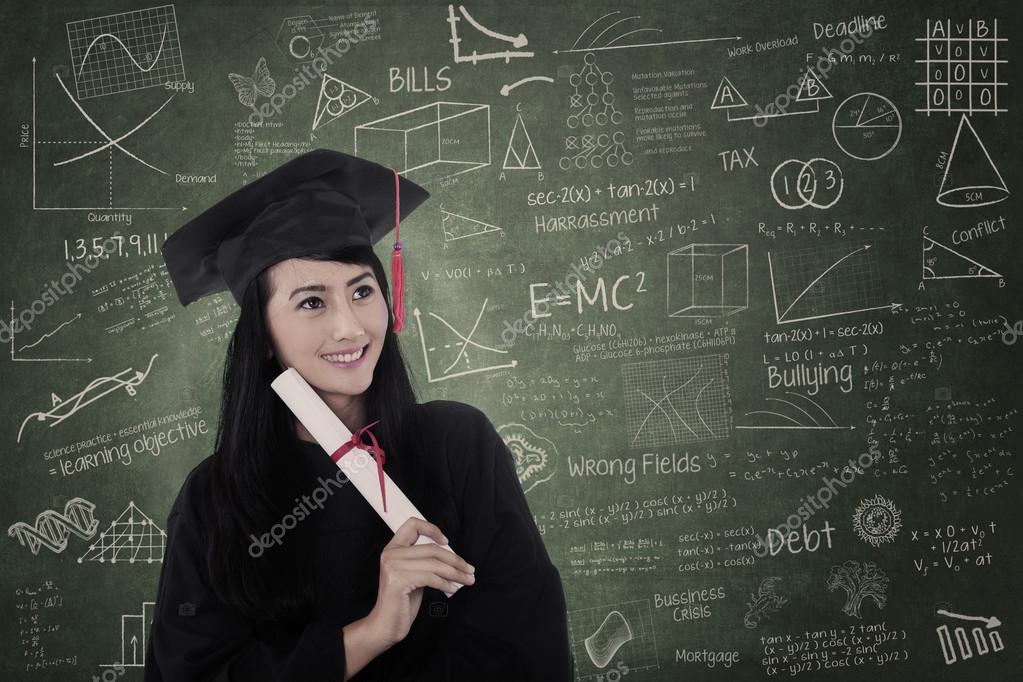 Beautiful woman graduated in class wearing graduation gown Stock Photo ...