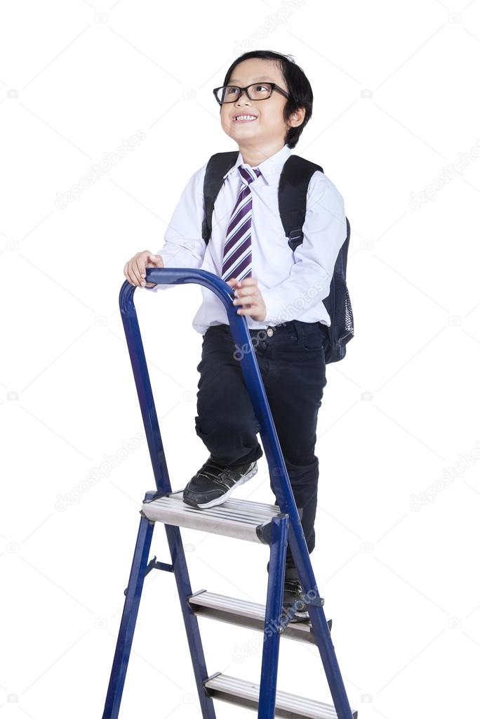 Child climbs up a ladder — Stock Photo © realinemedia #32160411