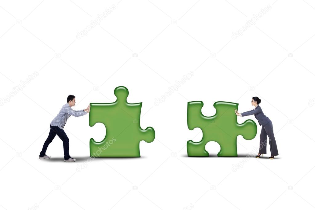 Isolated business partner putting together two puzzle Stock ... Isolated business partner putting together two puzzle Stock ...