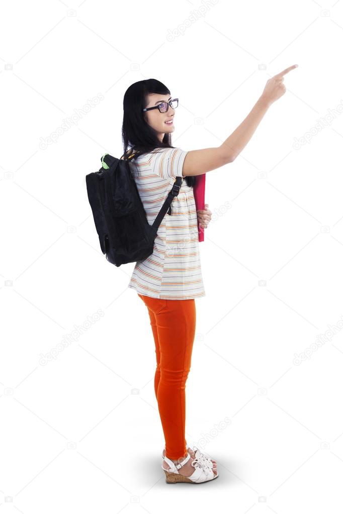Beautiful student girl pointing up — Stock Photo © realinemedia #38278505