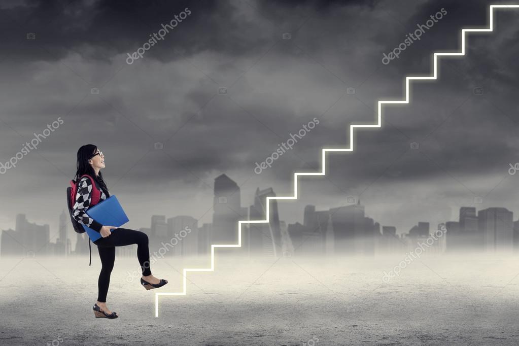 Female student climbing the stair Stock Photo by ©realinemedia 47297017