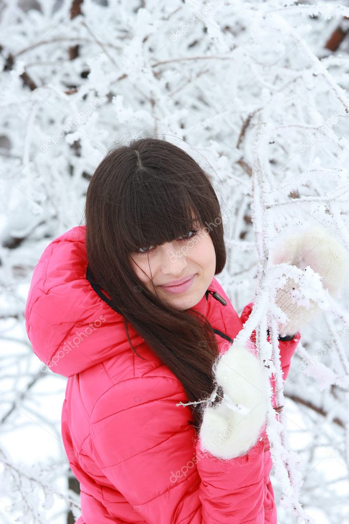 A young girl in a red jacket in the winter woods — Stock Photo ...