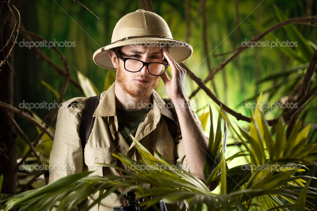 Explorer in the forest with headache Stock Photo by ©stokkete 47519767