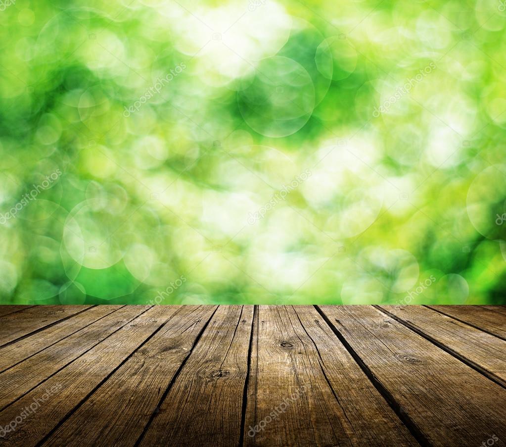 Table over beautiful green background Stock Photo by ©kwasny222 32506993