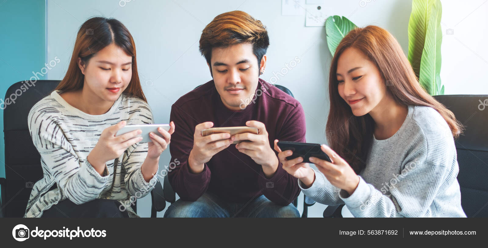 Group Young People Using Playing Games Mobile Phone While Sitting Stock ...