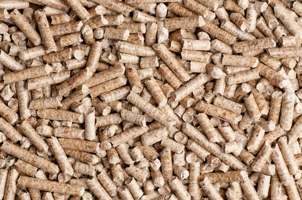 Wood pellet background pattern Stock Photo by ©Vbashutskyy 41876833