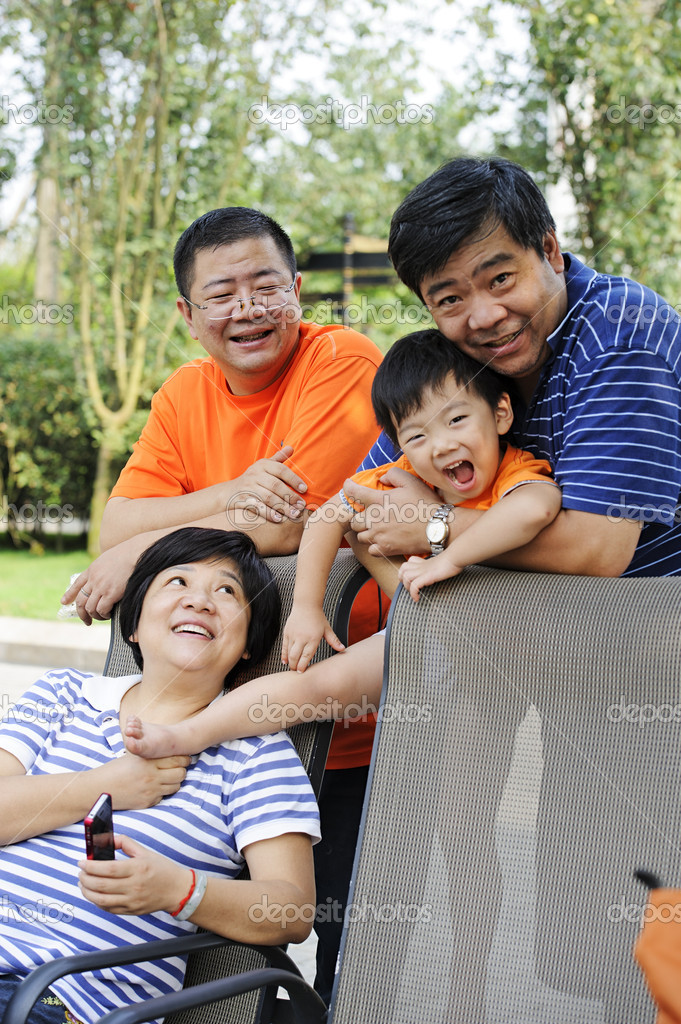 Happy kid playing with his uncle and aunt — Stock Photo © jackq #18145329